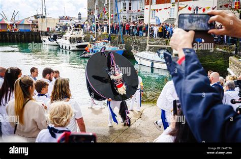 The Blue Oss By The Harbour At The Obby Oss Festival A Traditional Annual May Day Folk Event