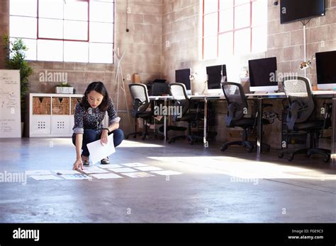 Female Designer Planning Layout On Floor Of Modern Office Stock Photo Alamy