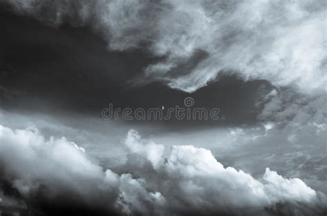 Monochrome Image Of Dense Clouds And Moon In The Sky Stock Image