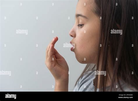 Little Asian Girl Covering Her Mouth For Smell Her Bad Breath Oral