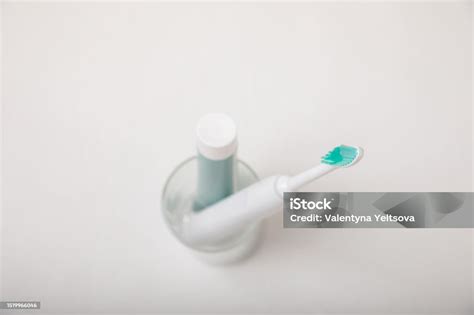 Bathroom With Sonic Electric Toothbrush Toothpaste Mouthwash Dental Floss And Tongue Cleaner