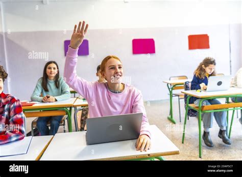 Smart Student Raises Her Hand To Ask A Question During Class Showing