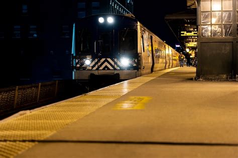 Free Photo Train Passing By Station At Night