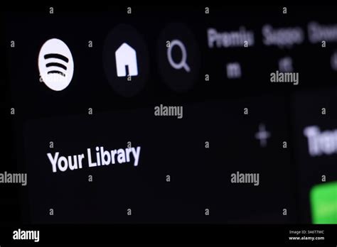 Spotify Mobile App Interface With Navigation Icons And Your Library