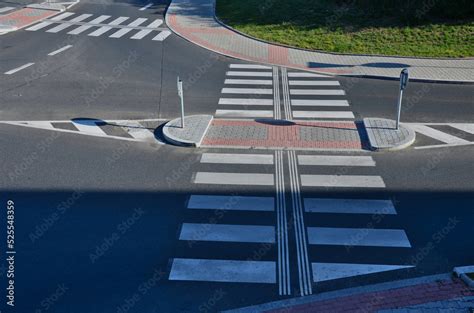 Directionally Divided Lanes At Intersection Crossing Has A Raised