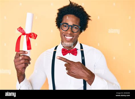 Handsome African American Nerd Man With Afro Hair Holding Graduate
