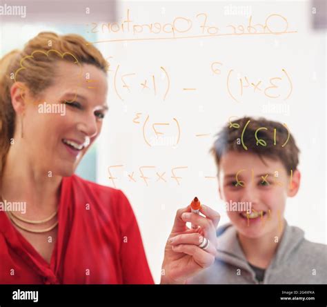 Mother Teaching Her Son Hi Res Stock Photography And Images Alamy