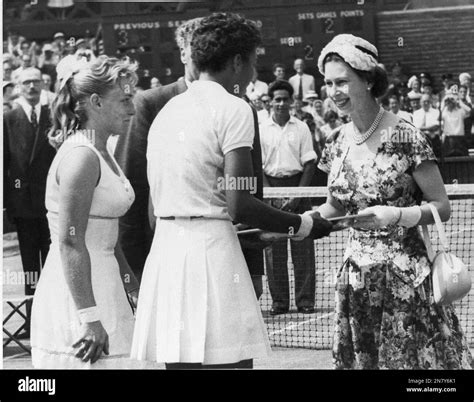 Queen Elizabeth Ii Of England Right Presents Winners Trophy To Althea Gibson Who Won The Women
