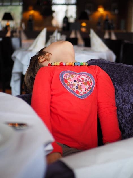 Premium Photo Girl Sitting At Table In Restaurant