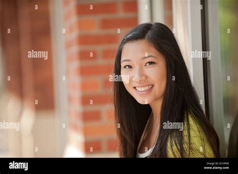 An Outdoor Portrait Of A Young And Pretty Chinese Teenage Girl Stock