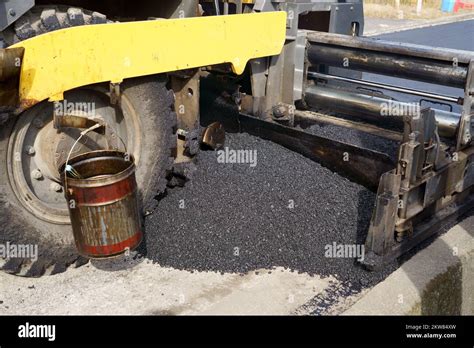 Paver Finisher Asphalt Finisher Or Paving Machine Placing A Layer Of