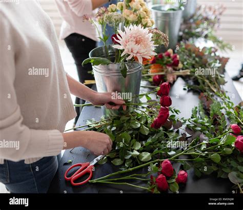 Close Up Flowers In Hand Florist Workplace Woman Arranging A Bouquet