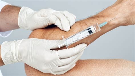 Doctor Administering Injection For Hyperhidrosis And Skin Whitening