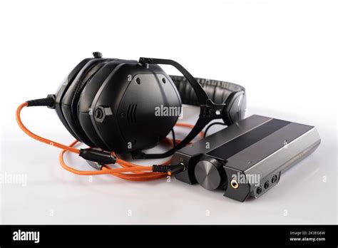 External Sound Card And Dac Connected To Headphones With The Orange Cable Isolated On White