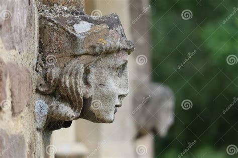 Stone Angel Woman Gargoyle Sculpture At Church Entrance Stock Image