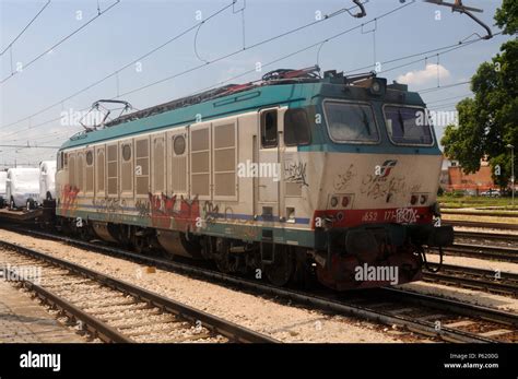 A Trenitalia Class E652 Electric Locomotive Stands At The Head Of A