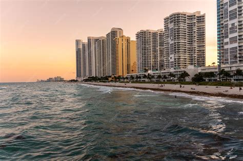 Premium Photo A Beach With Buildings And The Ocean In The Background
