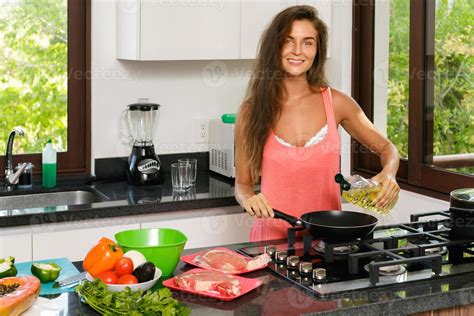 Woman Housewife During Cooking Process In The Kitchen 16204766 Stock