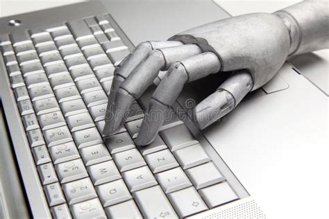 futuristic robot hand typing and working with laptop keyboard