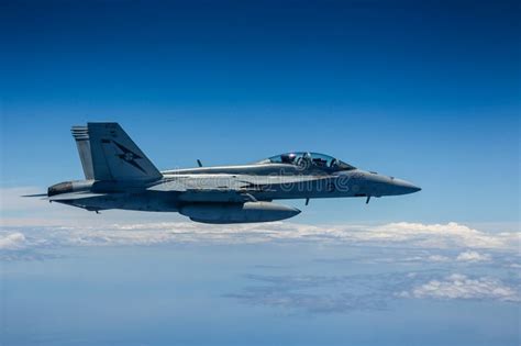 An Australian Raaf Fa18 Super Hornet Flying At Altitude Against A Blus