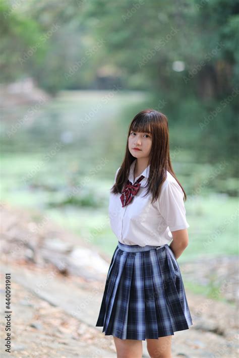 Beautiful Asian Japanese School Girl Uniform Looking At Park Outdoor