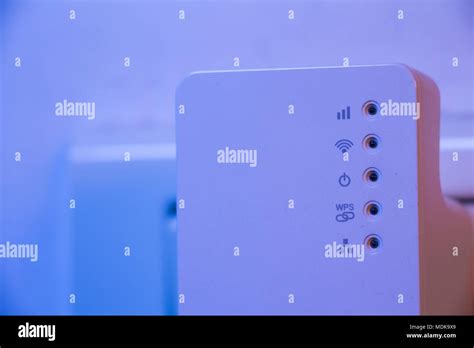 Closeup On Wifi Repeater Signal Connection Status Led Lights The Device Is In Electrical Socket