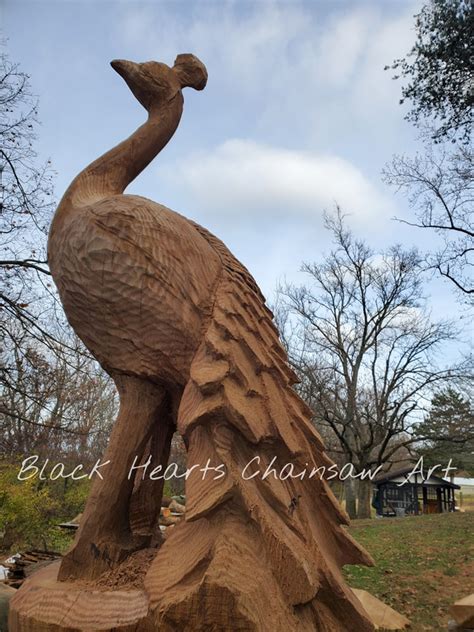 Theres A Peacock Hiding Out Black Hearts Chainsaw Art