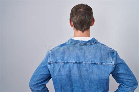 Caucasian Blond Man Standing Wearing Glasses Standing Backwards Looking