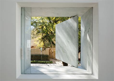 Triptyques Marble Building Is Made To Look Like An Ice Cube