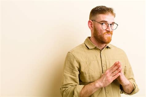 Premium Photo Young Blonde Guy Scheming An Evil Plan Or Thinking