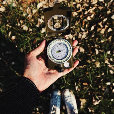 Premium Photo Hand Hold Compass Guide Direction Navigation