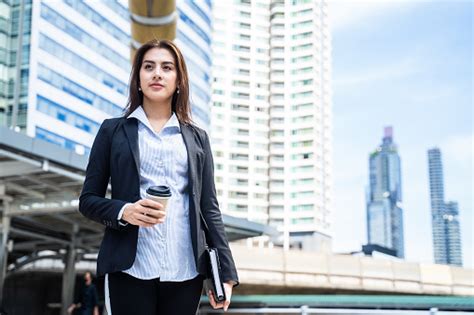 Asian Young Couple Office Business People Stand Outdoor In City With Confident Face Holding Hot