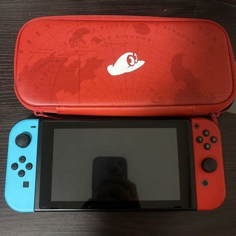 Nintendo Switch 青赤 本体 キャリングケース メルカリ