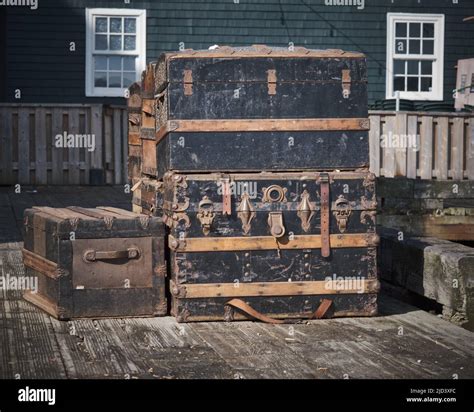 Old Vintage Travelling Trunks On A Dockside Ready For Boarding Stock