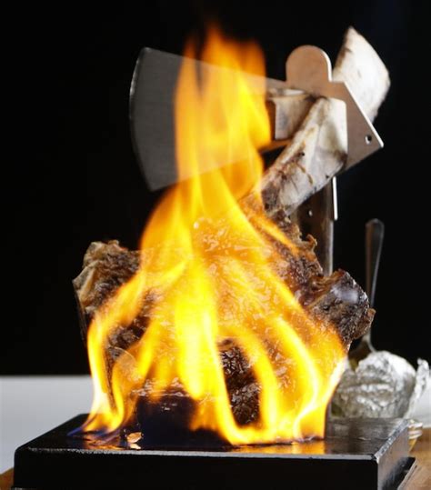 Premium Photo Close Up Of Metal Burning On Table Against Black Background