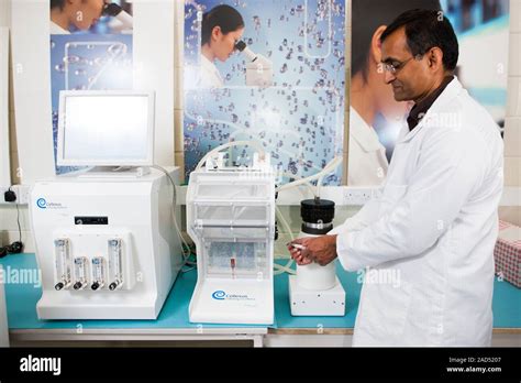 Bioreactor Sampling Technician Taking A Sample From The Enclosure Part
