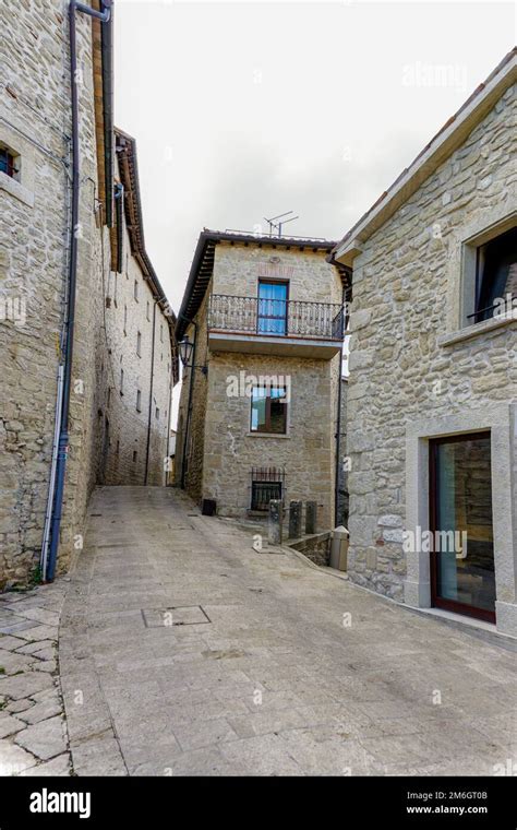 Narrow Street With Massive Stone Buildings In The Historic City Center