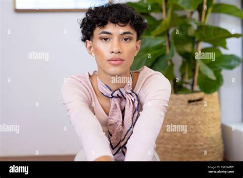 Sitting Indoors Transgender Transgender Woman Posing Confidently With