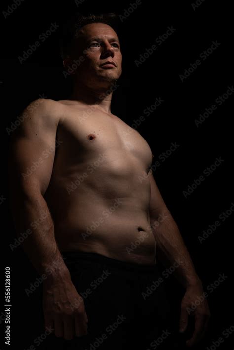 Sexy Portrait Of Muscular Handsome Topless Male Isolated Against A