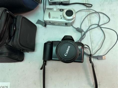 1 Canon Eos Rebel Digital Camera And Assorted Digital Cameras Gavel Roads Online Auctions