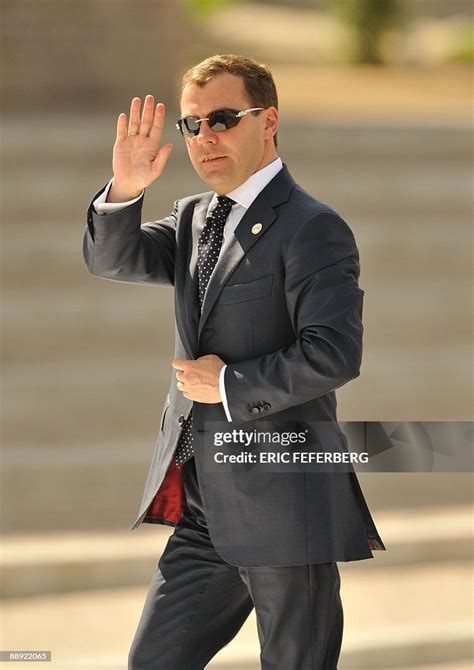 Russian President Dmitri Medvedev Waves Upon His Arrival To Attend