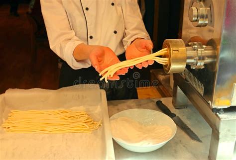 Pasta Maker Girl Taking With Her Hands The Fresh Egg Pasta Just Extruded From The Industrial