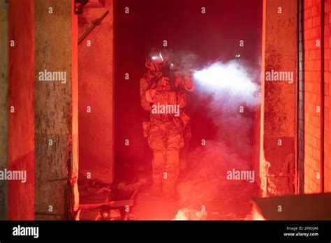 Expert Team Of Soldiers Attacking Enemy During Military Operation Stock