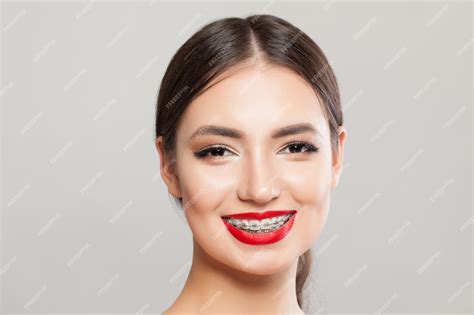 Premium Photo Cheerful Woman With Braces On Teeth Beautiful Model In