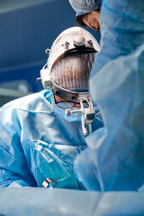 Team Of Surgeons Makes An Invasive Operation Portrait Of Surgeons