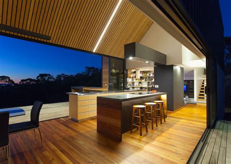 Rural Tasmanian House Has A Terrace Piercing Its Middle