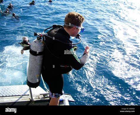 Scuba Diver Jumping Into The Water From A Dive Boatcoastal Waters
