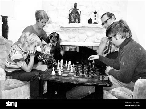 Chicago Daily News Columnist Mike Royko And His Wife Carol Watch A Chess Game Between Their