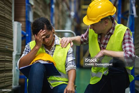 Young African Female Warehouse Worker Staff Feeling Sad And Upset While