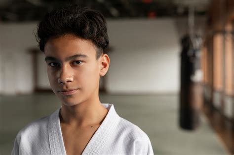Free Photo Front View Asian Boy Practicing Taekwondo